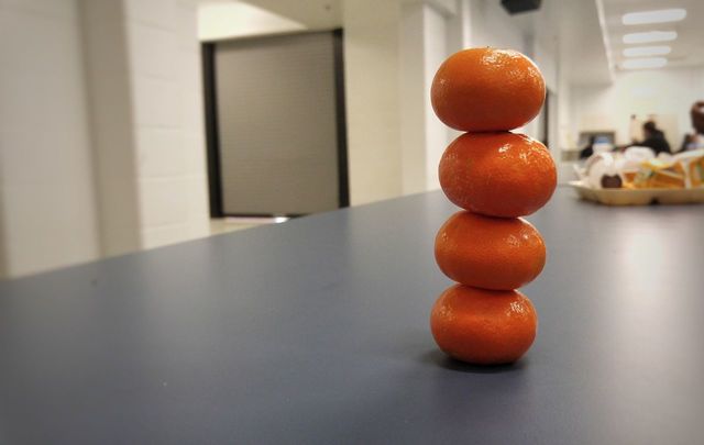 Close-up of stacked oranges on table | ID: 100819450