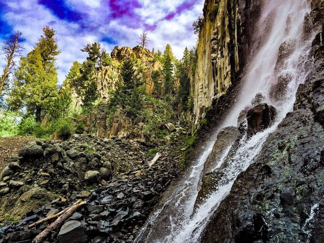 Low angle view of waterfall against sky | ID: 90111800
