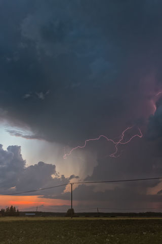 Low angle view of lightning in cloudy sky | ID: 90390419