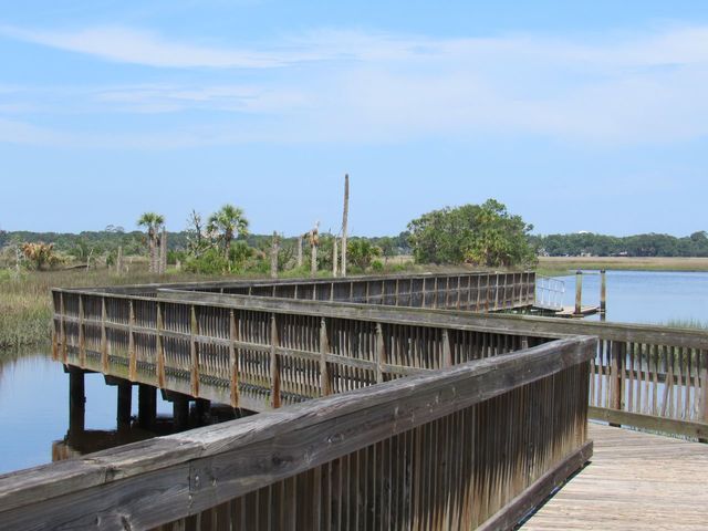 Wooden pier on lake against sky | ID: 124021774