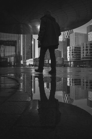 Rear view of man standing at night | ID: 80919306