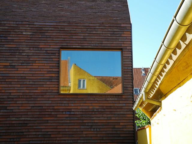 Low angle view of houses against clear blue | ID: 92944088
