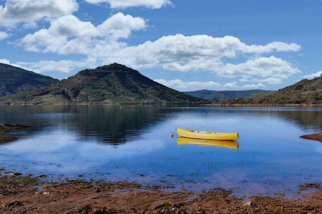 Yellow boat in the amazingly blue water of | ID: 209771732