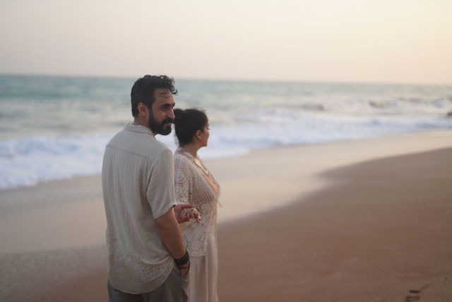Side view of woman standing at beach | ID: 216518568