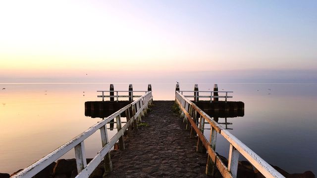 Pier over sea against clear sky | ID: 111073204