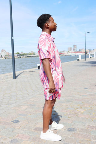 Side view of young woman standing at beach | ID: 215869313