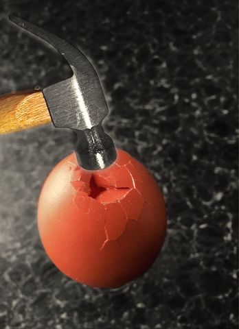 Close-up of hammer smashing egg | ID: 83728437