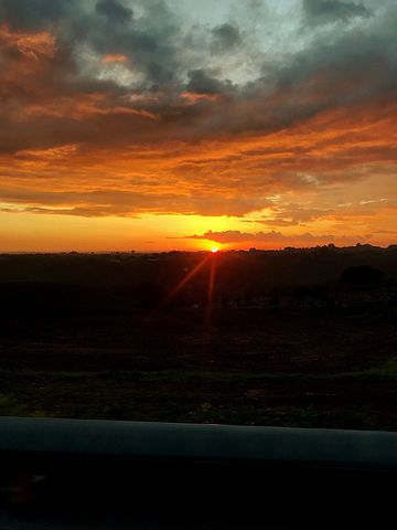 Scenic view of sunset over land | ID: 130895856